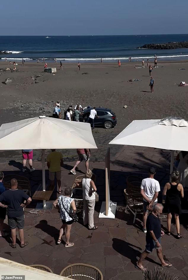 Moment hapless holidaymaker gets hire car stuck in sand after driving ...