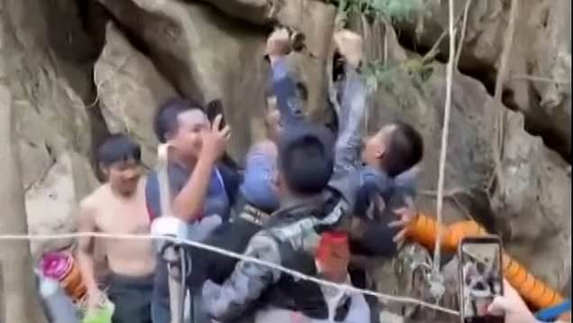 Rescue team cheers as five trapped in Laos cave saved after a week
