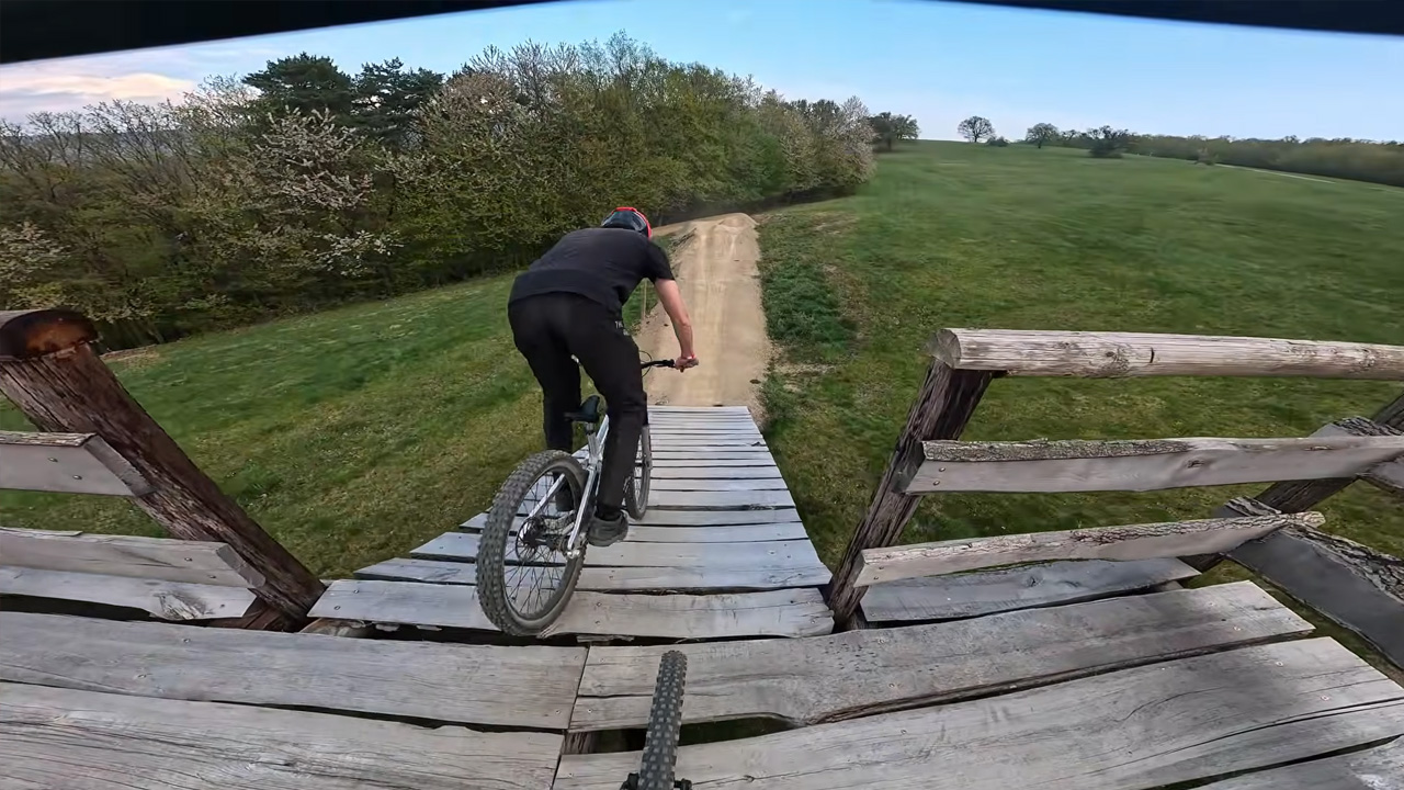 POV Blasting Through Dust and Huge Wooden Ramps In Dirt Bike