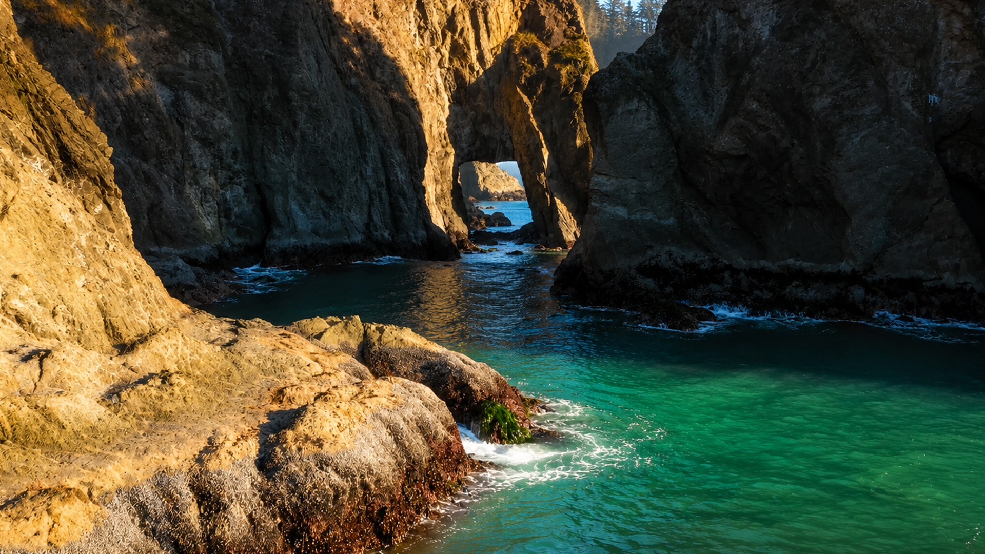 How was this hidden sea cave formed naturally?