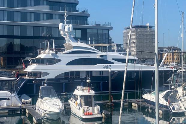 Huge superyacht with glass elevator and grand piano docks in Southampton