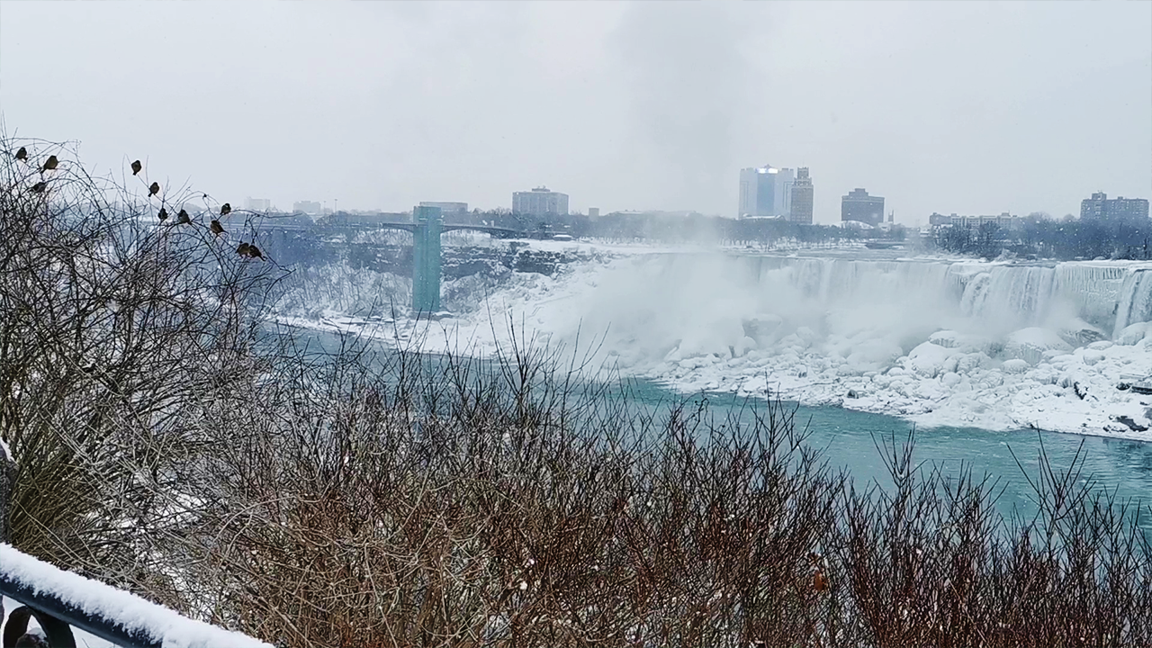 Blue icicles spotted near frozen Niagara Falls