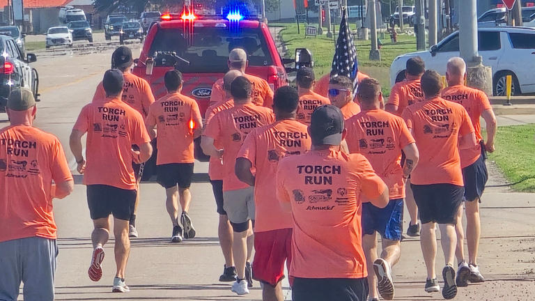 Area law enforcement officers participate in Torch Run for Special ...