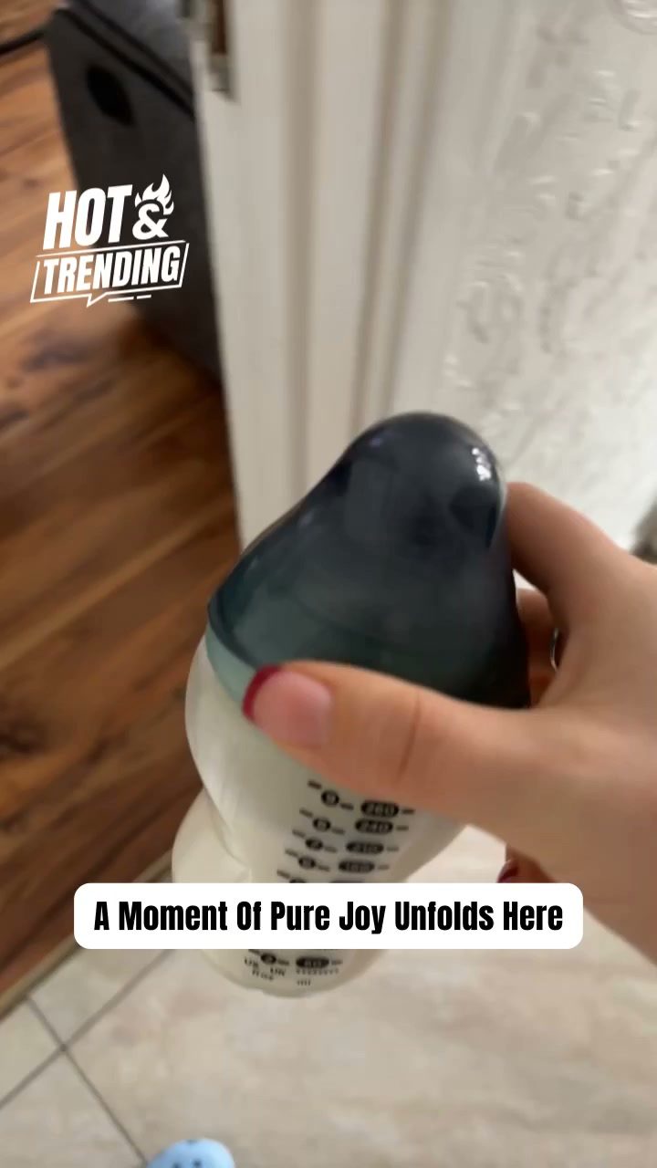 Toddler's joyful reaction to a baby feeding bottle
