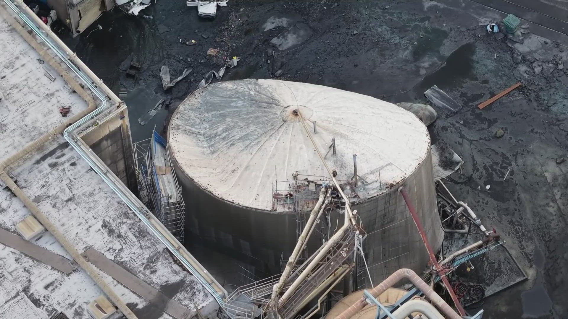 A tank holding 900,000 gallons of corrosive chemicals imploded. Experts ...