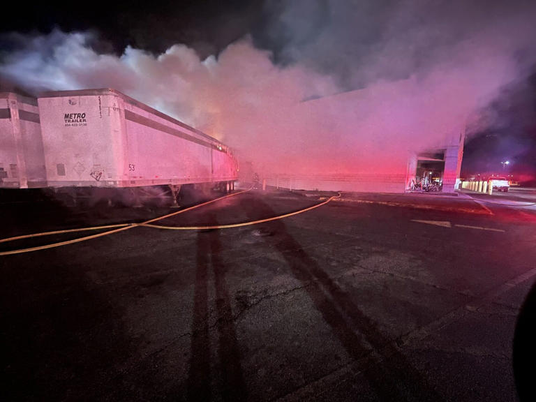 Fire damages 18-wheeler storage trailers outside Love Lady Thrift Store