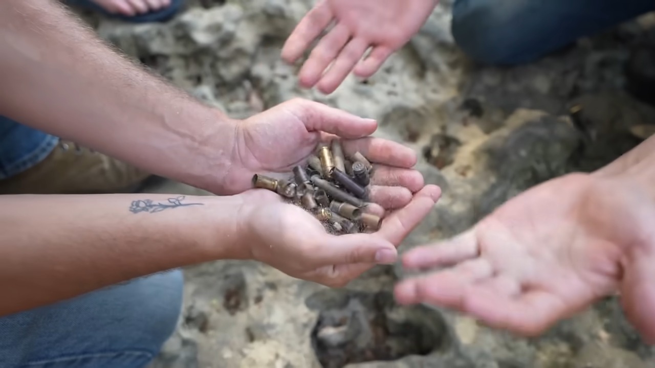 They came looking for fossils - then found a pistol and 146 bullets ...