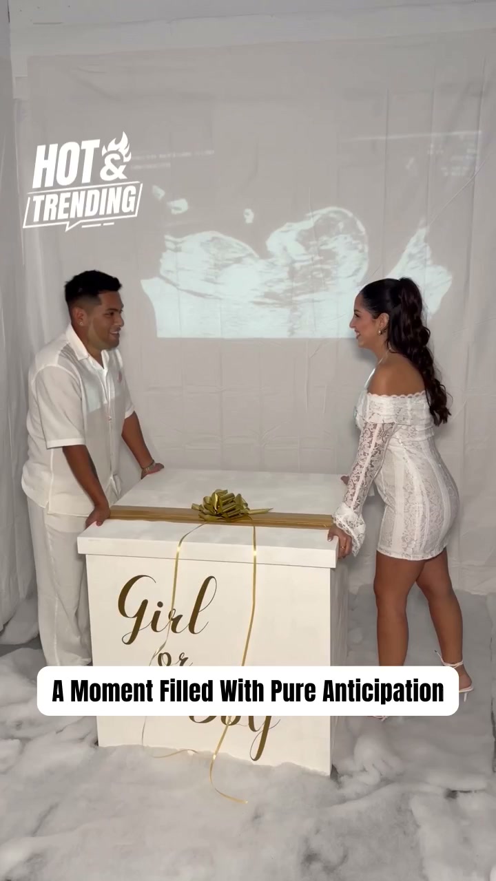Blue balloons emerge from a big box during gender reveal
