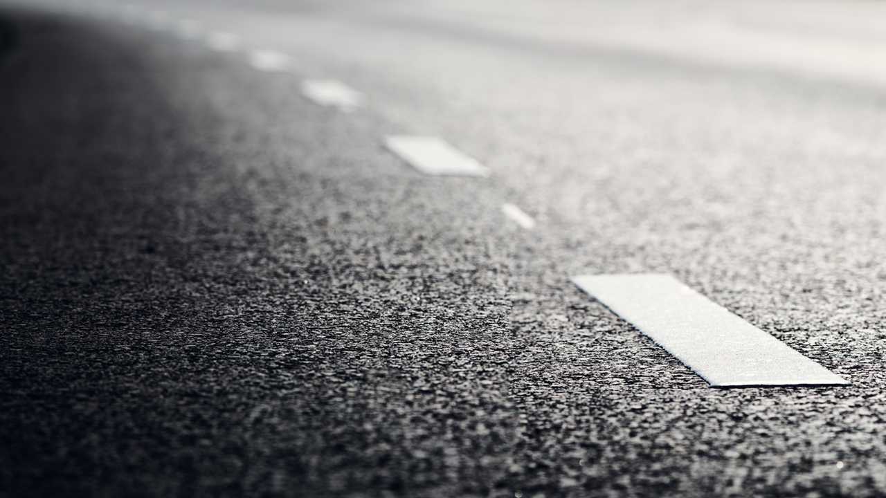 Man found dead in roadway after being hit by car, coroner says