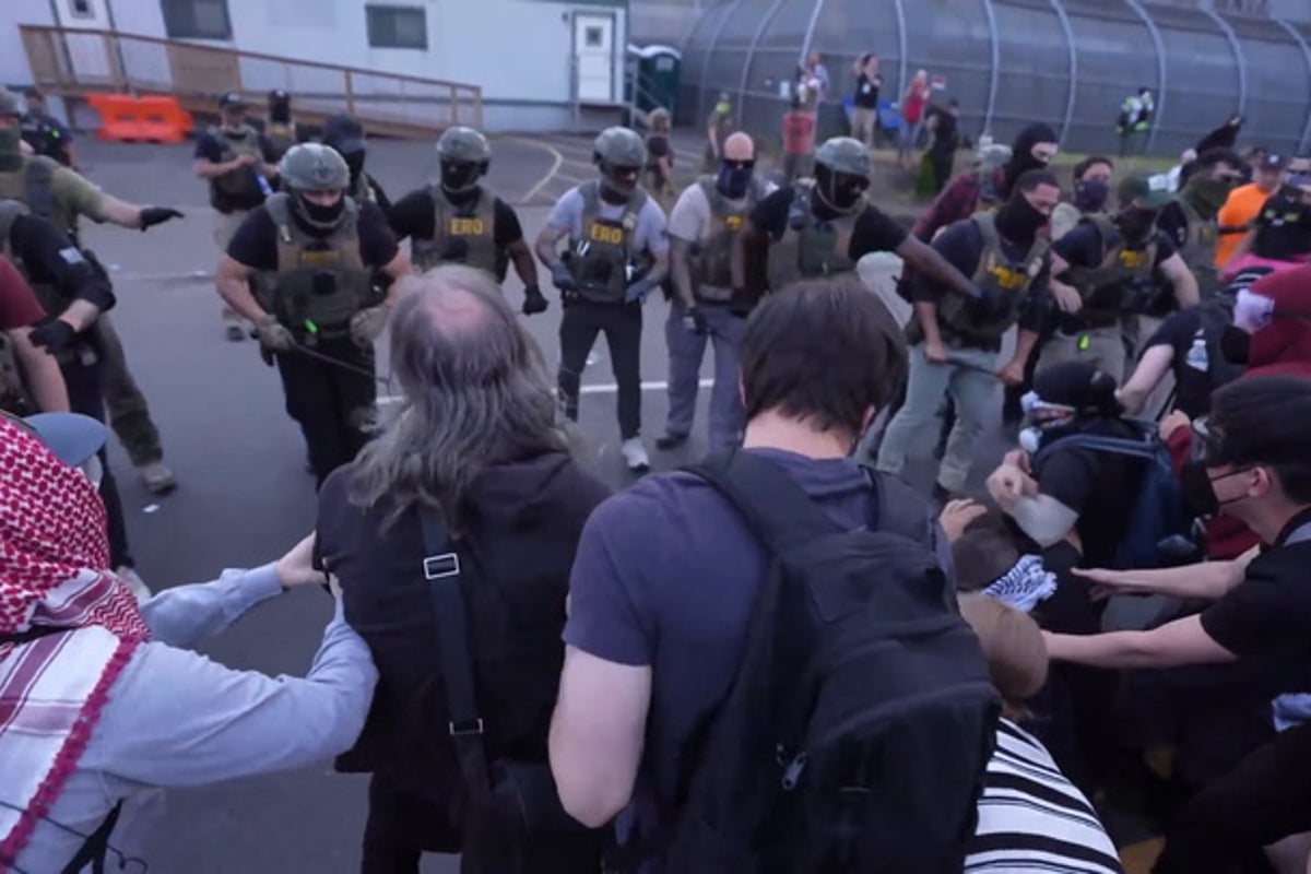 Anti-ICE protesters and federal agents clash outside detention center