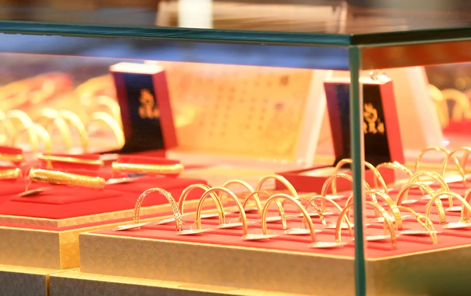 Gold hits two-month low as UBS trims forecast