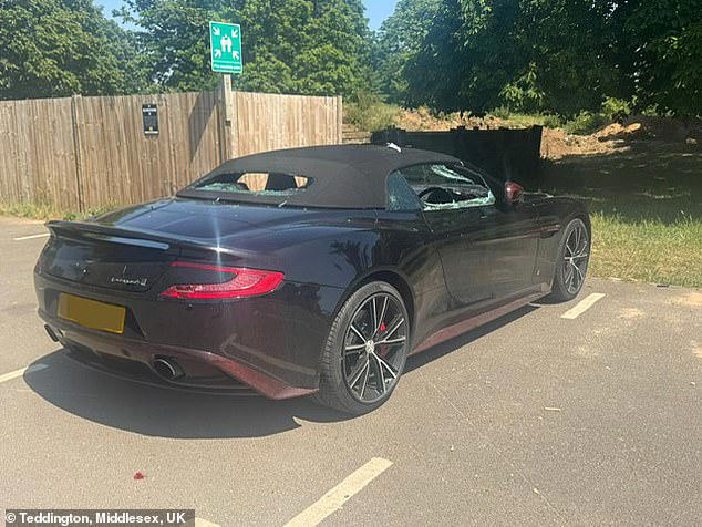 Masked vandal smashes windscreen of £250,000 Aston Martin before spray ...