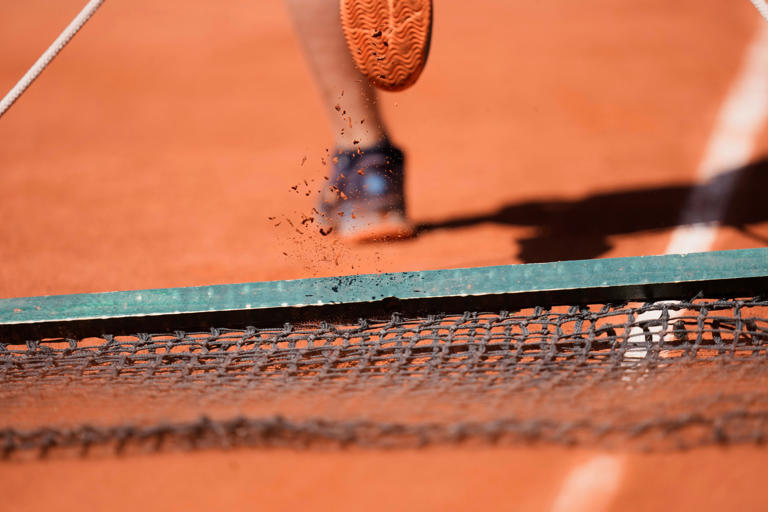 French Open groundskeepers drench the clay courts with water and salt ...