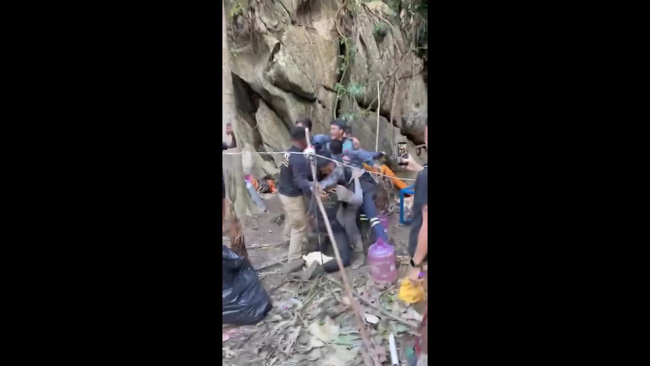 Laos cave rescue team celebrate as five trapped workers are found alive