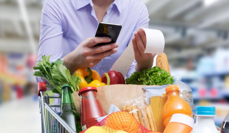 Woman compares grocery shopping receipt from 20 years ago