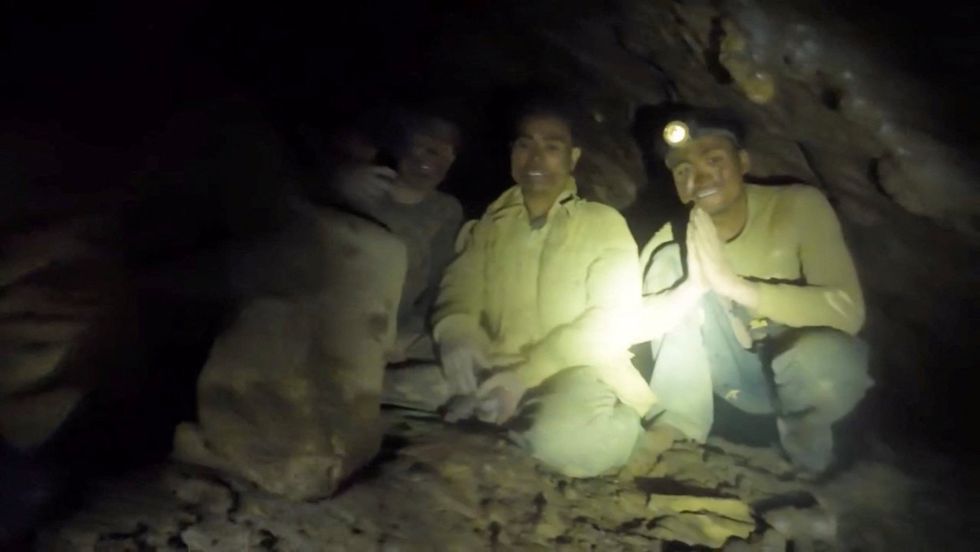 Rescue divers discover five gold-hunters alive after group became ...