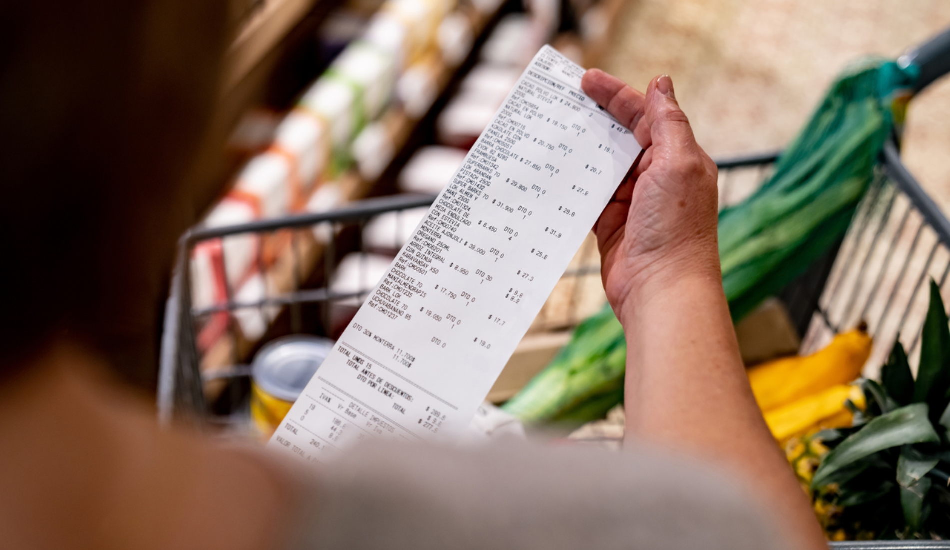 Woman compares grocery shopping receipt from 20 years ago