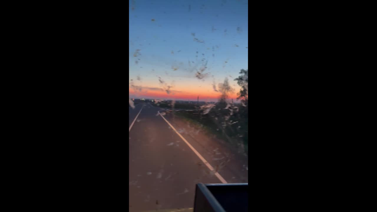 Swarm of May beetles hits windshield while driving in Orsha, Belarus