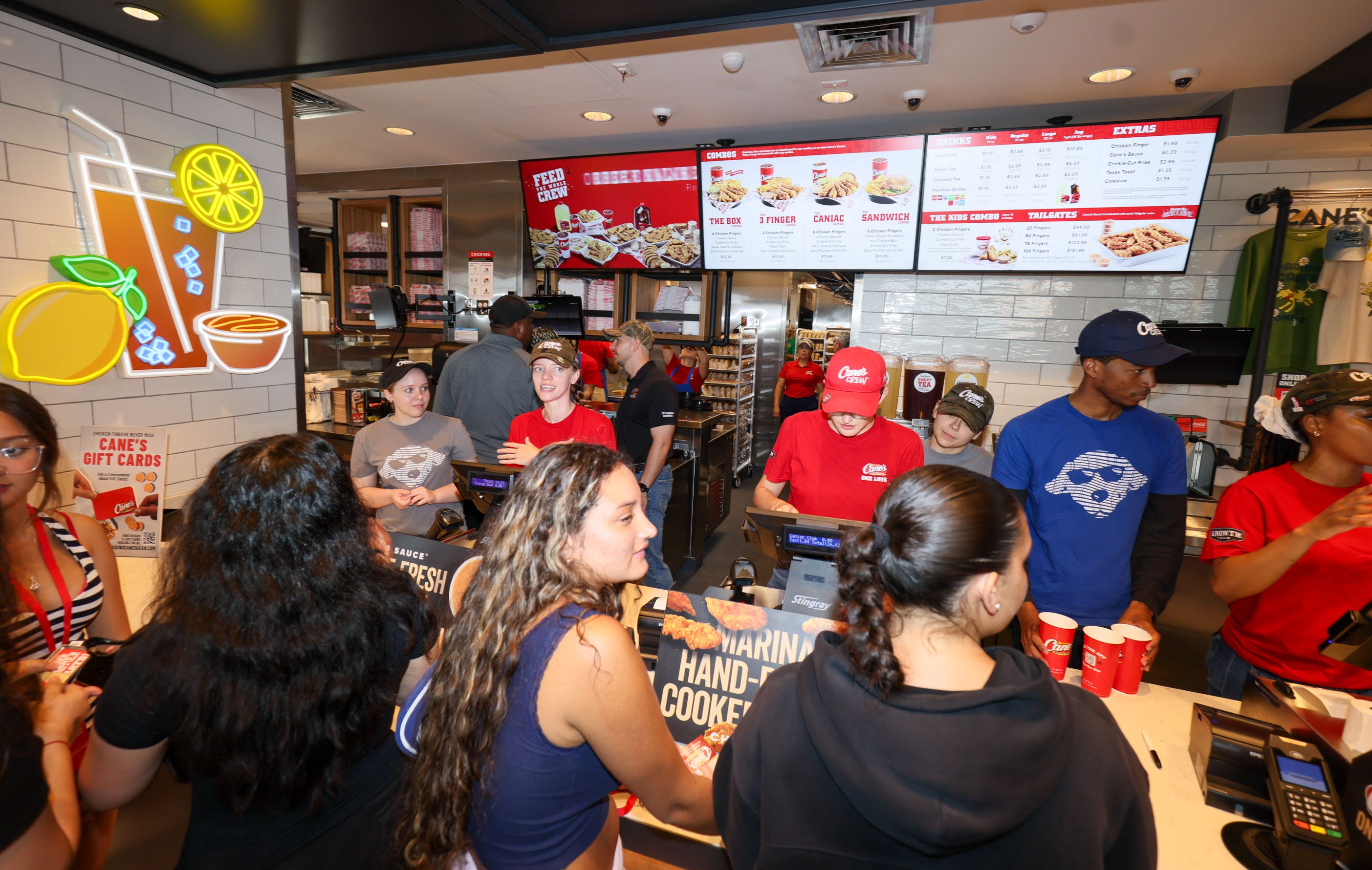 Big crowd greets new Raising Cane’s opening in Gainesville