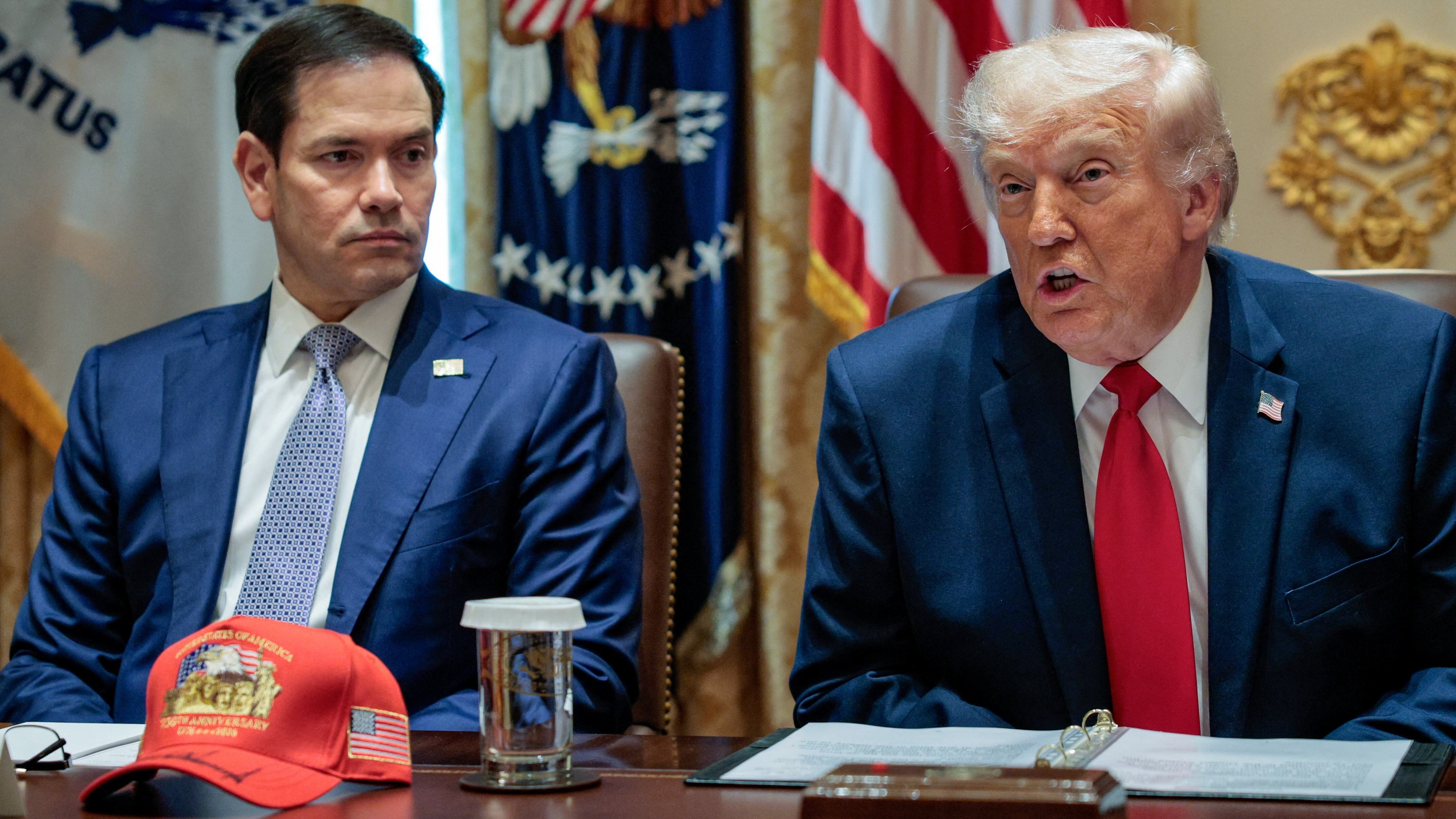 Trump uses cabinet meeting to flog tacky $55 hats