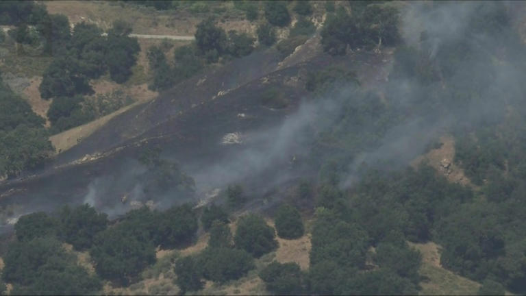 Crews work to contain brush fire near Malibu Canyon Road in Calabasas
