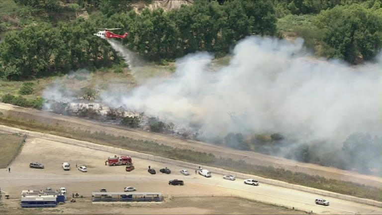 Helicopter, hand crews battle brush fire near Sepulveda Basin golf course