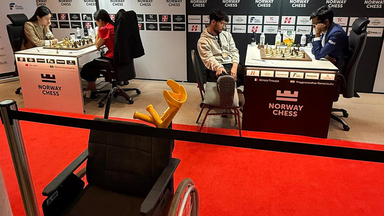 Sitting in a wheelchair after ankle injury, Firouzja makes heads turn