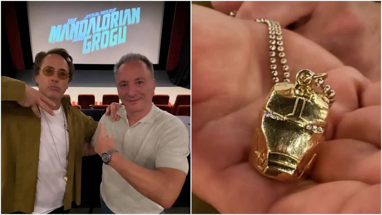 Robert Downey Jr. showcases his golden Iron Man necklace at the ...