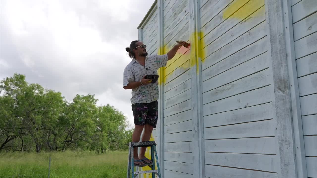 Artist Cameron Walls turns blank spaces into community murals