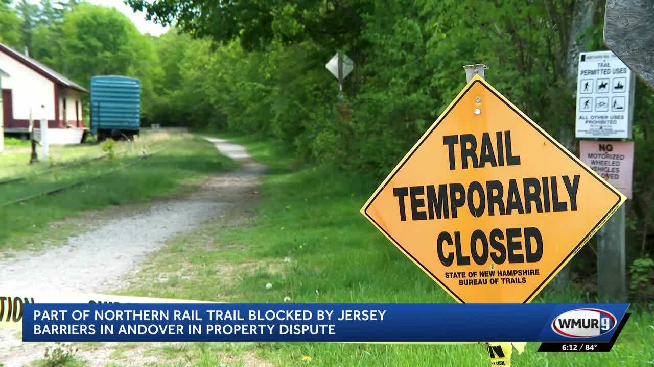 Part of Northern Rail Trail blocked by concrete barriers in property ...