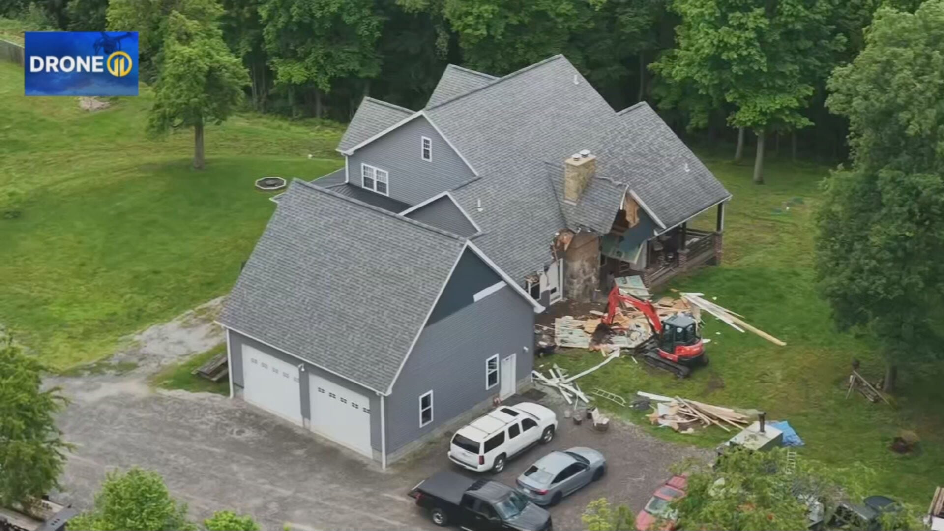 Man accused of trying to destroy his home with an excavator while his ...