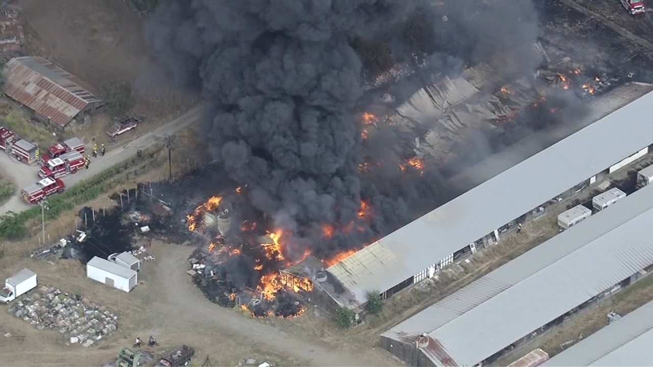 Firefighters battling 5‑acre brush and structure fire in Livermore