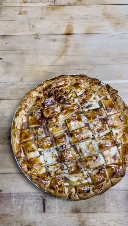Homemade peach pie with a golden flaky crust