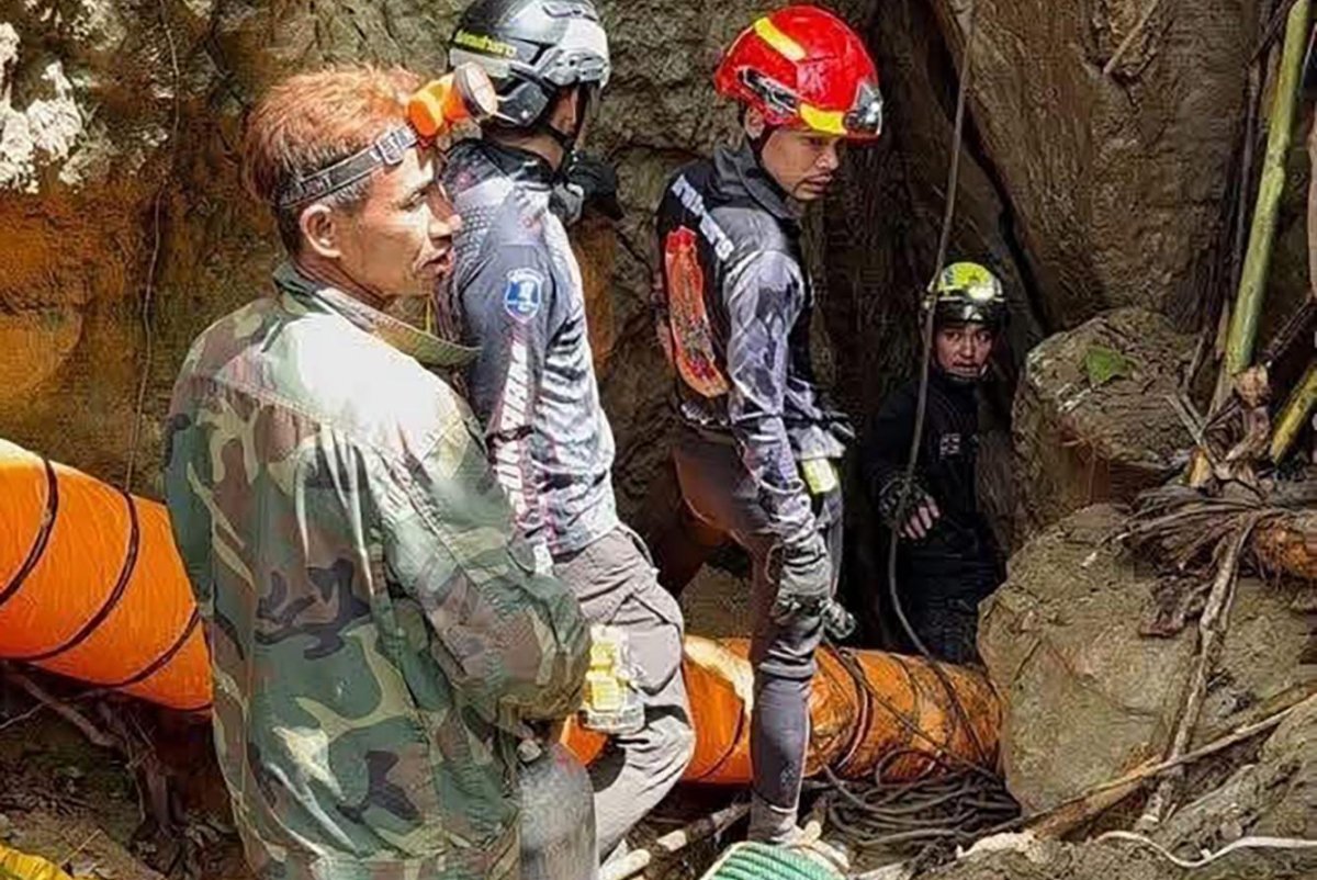 Rescuers reach men trapped in Laos cave, getting them out will be 'tough'