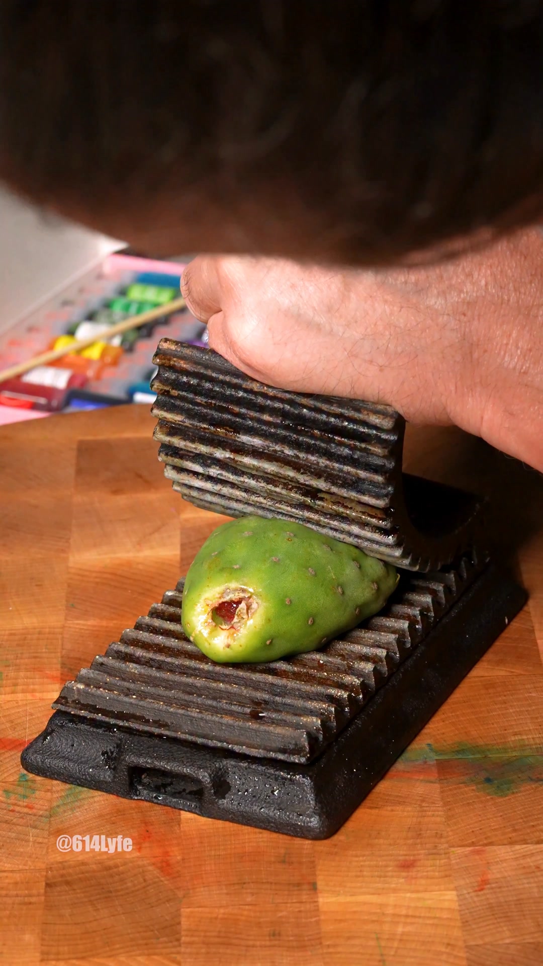 Hand press vs green cactus flower