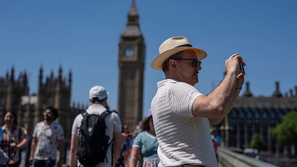 UK swelters in record 35.1°C May heat as storms loom