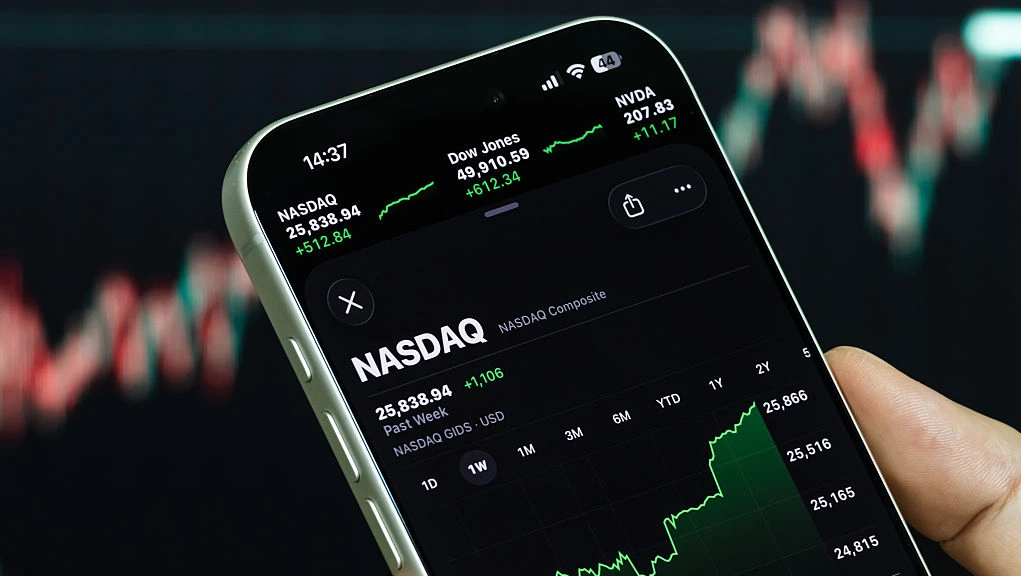 Dow hits record close as investors rotate beyond AI stocks