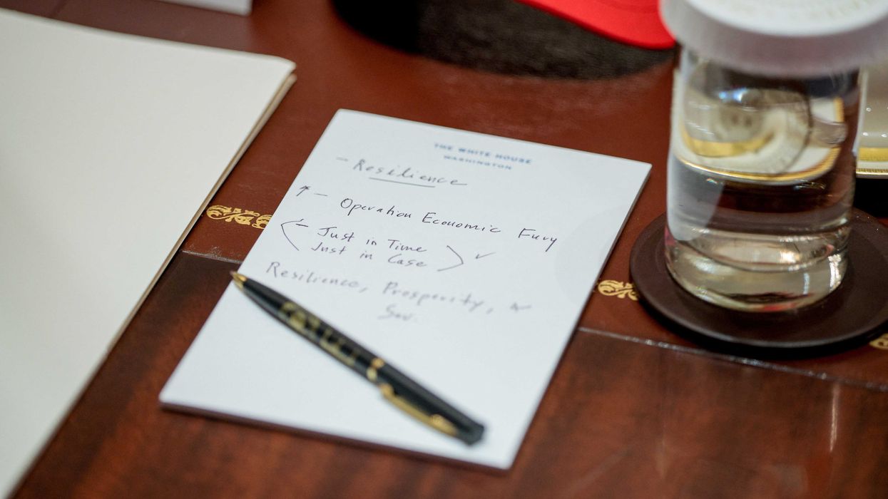 Photographer catches Scott Bessent writing mantra to himself during ...