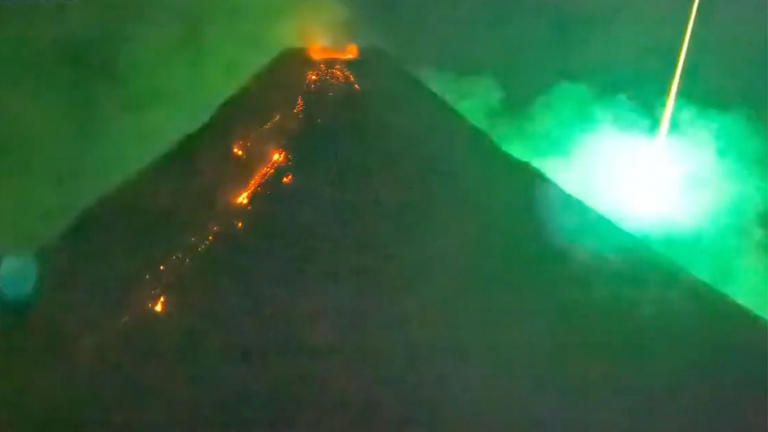 A dazzling meteor just 'video bombed' a volcanic eruption