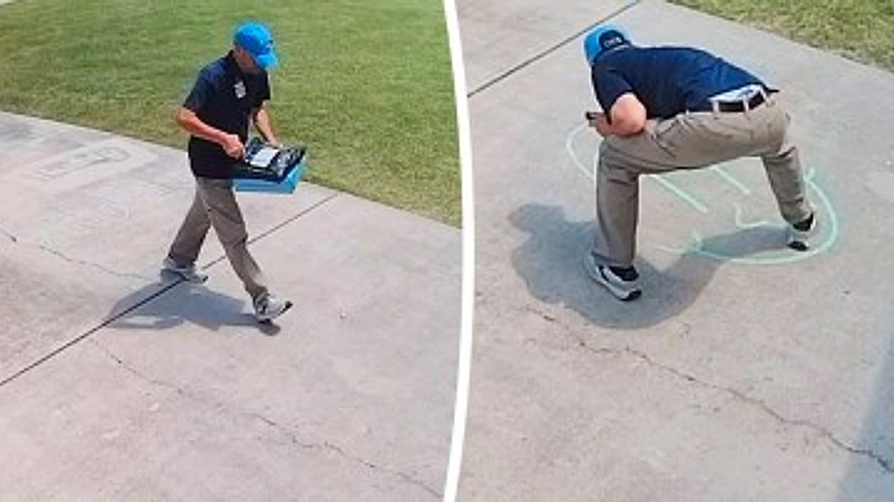Mailman stops mid-route to add smiley face to child's chalk drawing