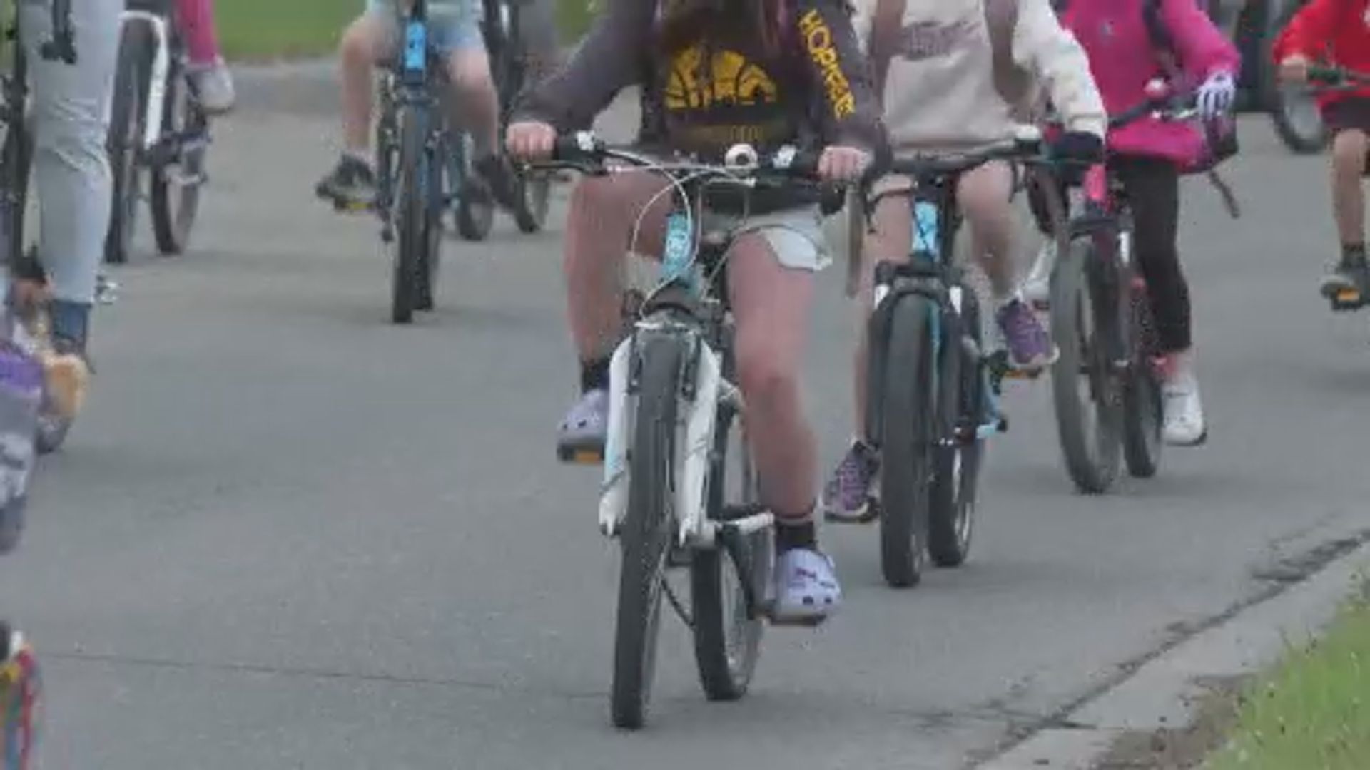 Dozens of Calgary students join in on the weekly bike bus aimed at ...