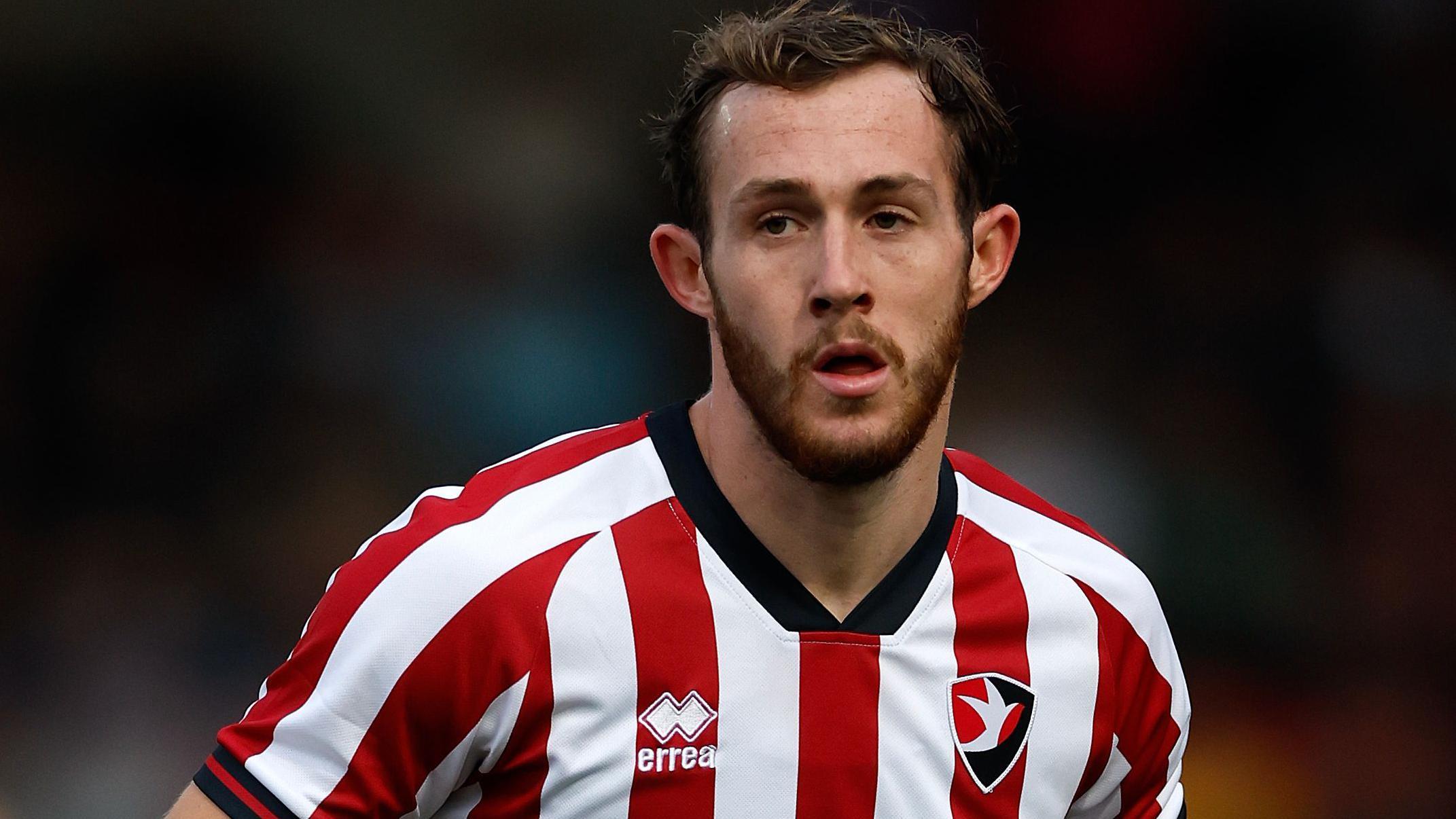 Woking sign striker Dulson on two-year deal