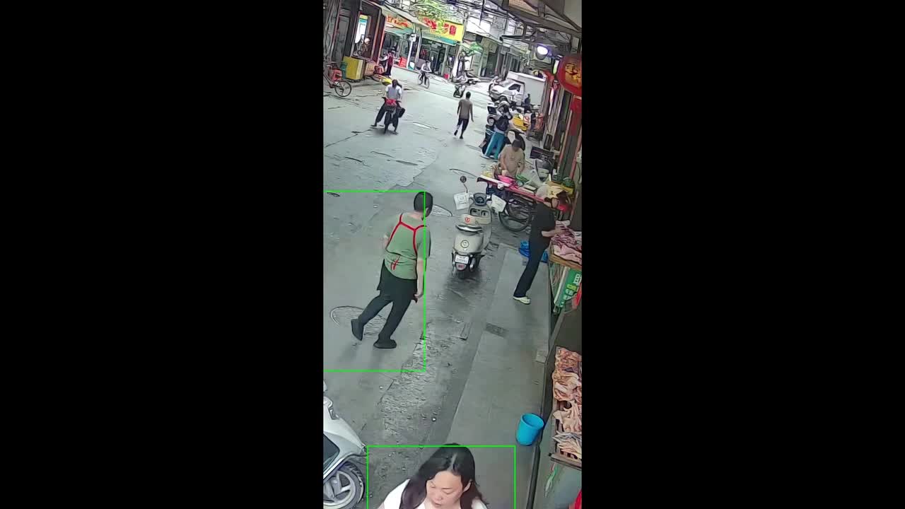 Large branch snaps off tree and lands on passing biker in China