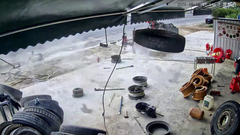 Car tyre shoots into the air – narrowly missing shop owner