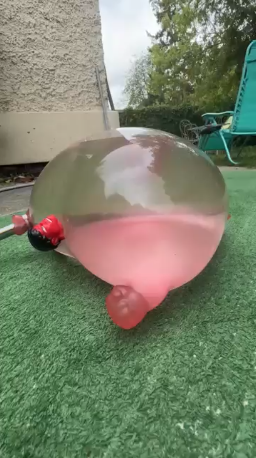 Stretchy toys flood my garden: giant toy chaos everywhere