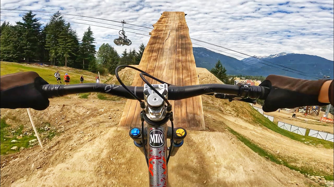 POV MTB rider heads straight toward a huge drop