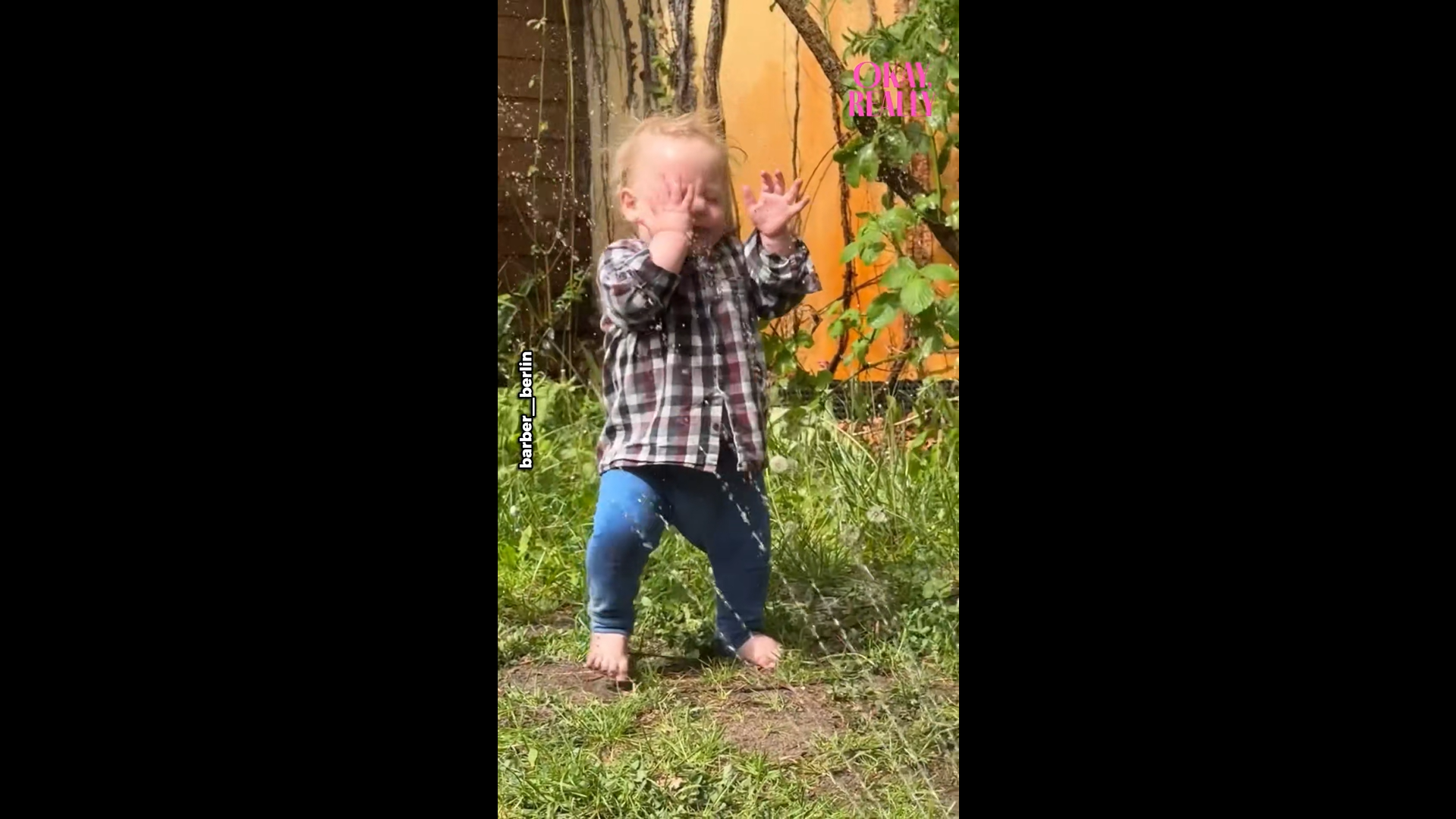 Baby has hilarious shock reaction after running through sprinkler
