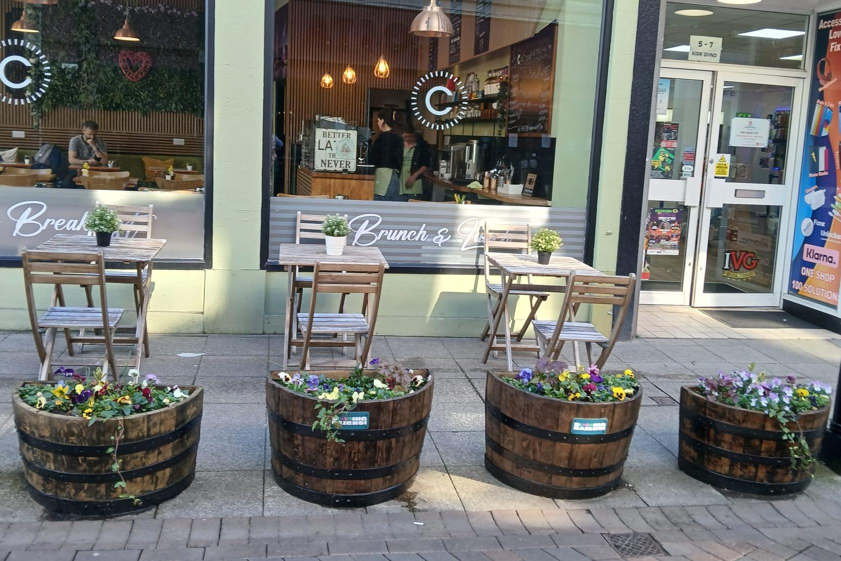 Blooming bairns: Quarter and half barrels add colour to Falkirk town centre