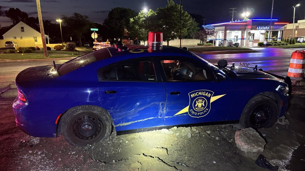 MSP patrol car struck by another vehicle on Nine Mile Road, police say