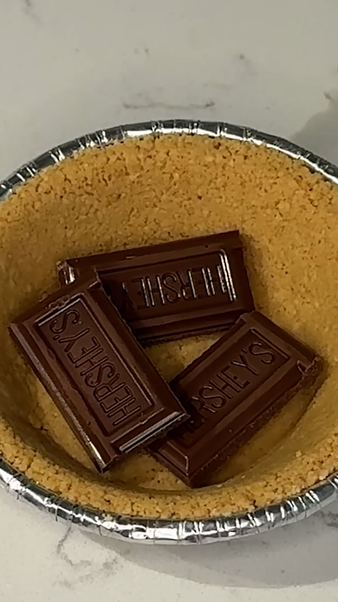 Skillet dessert features graham, chocolate, and marshmallow layers
